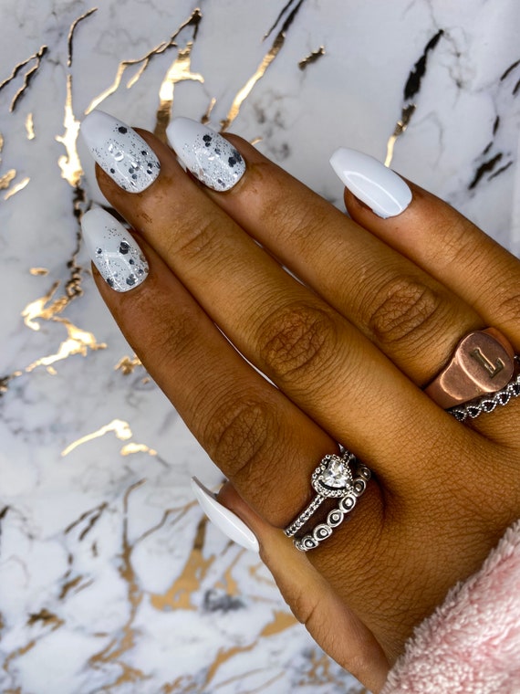 White nails with ring finger glitter store
