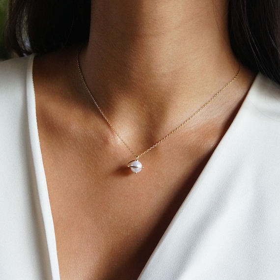Pearl necklace with gold saturn store