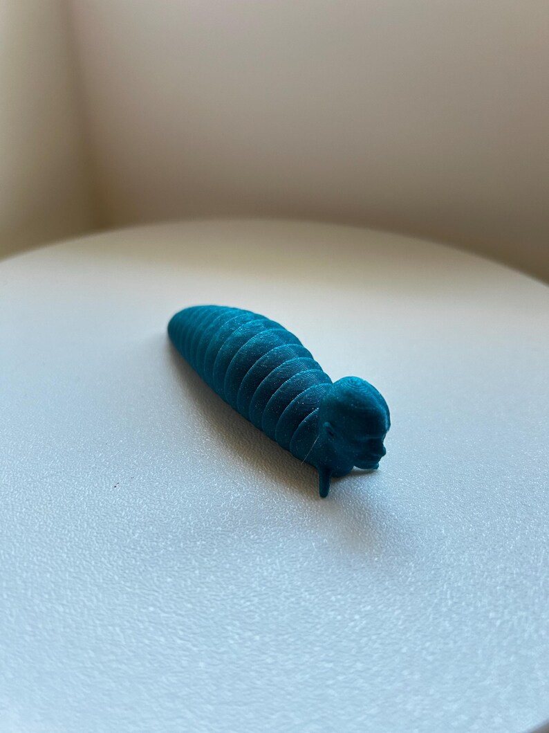 3D Printed Articulated Slug With the Rock's Face - Unique Desk Toy ...