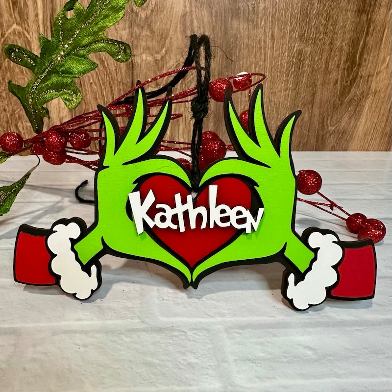 Grinch mano del corazón - Etsy España