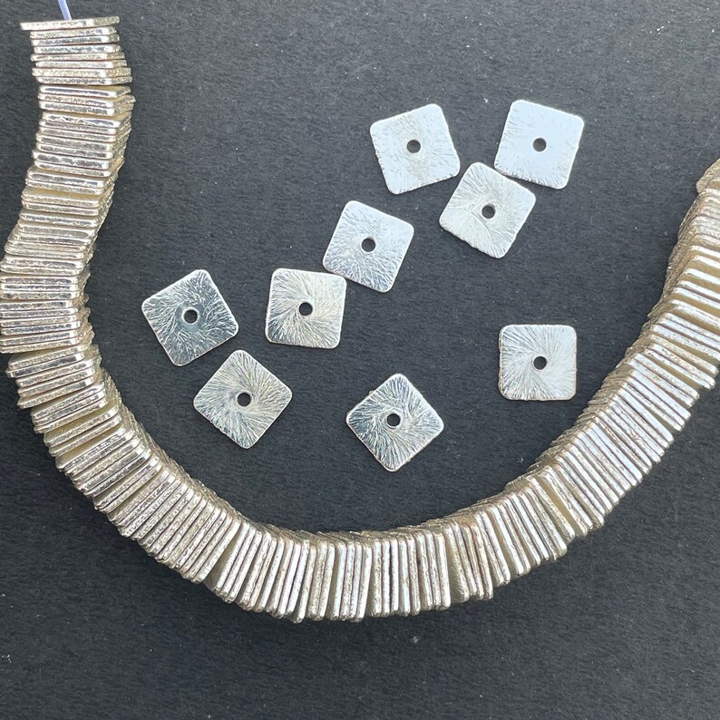 A Strand of Square Disc, Gold Finish ,silver Plated and Gunmetal E ...