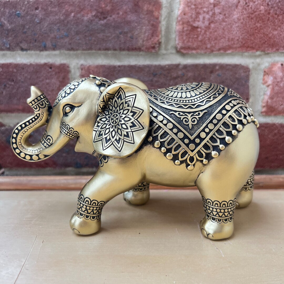 Exquisite Golden Elephant Statue: Elegant Ornament in Brilliant Gold ...