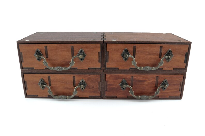 A Wooden Chest of Drawers for Storing Accessories and Threads for ...