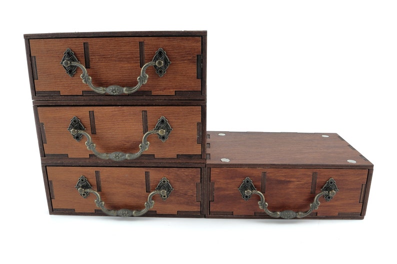A Wooden Chest of Drawers for Storing Accessories and Threads for ...