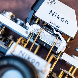 Disassembled Mechanical Film Camera, Deconstructed Nikon EM, Nikon FG ...