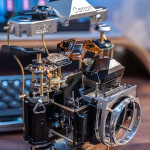 Disassembled Mechanical Film Camera, Deconstructed Canon AE-1 Canon FT ...