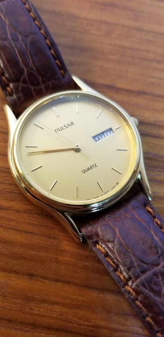 Men's vintage Pulsar P1 gold tone wristwatch with day and | Etsy