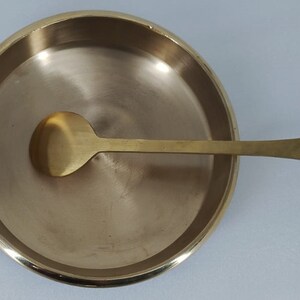 Bronze Traditional Cooking Uruli Polished With Spatula. Urli Bronze ...