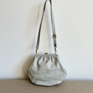 A Small Light Gray Leather Purse With a Gold Clasp Shoulder Women’s Bag ...