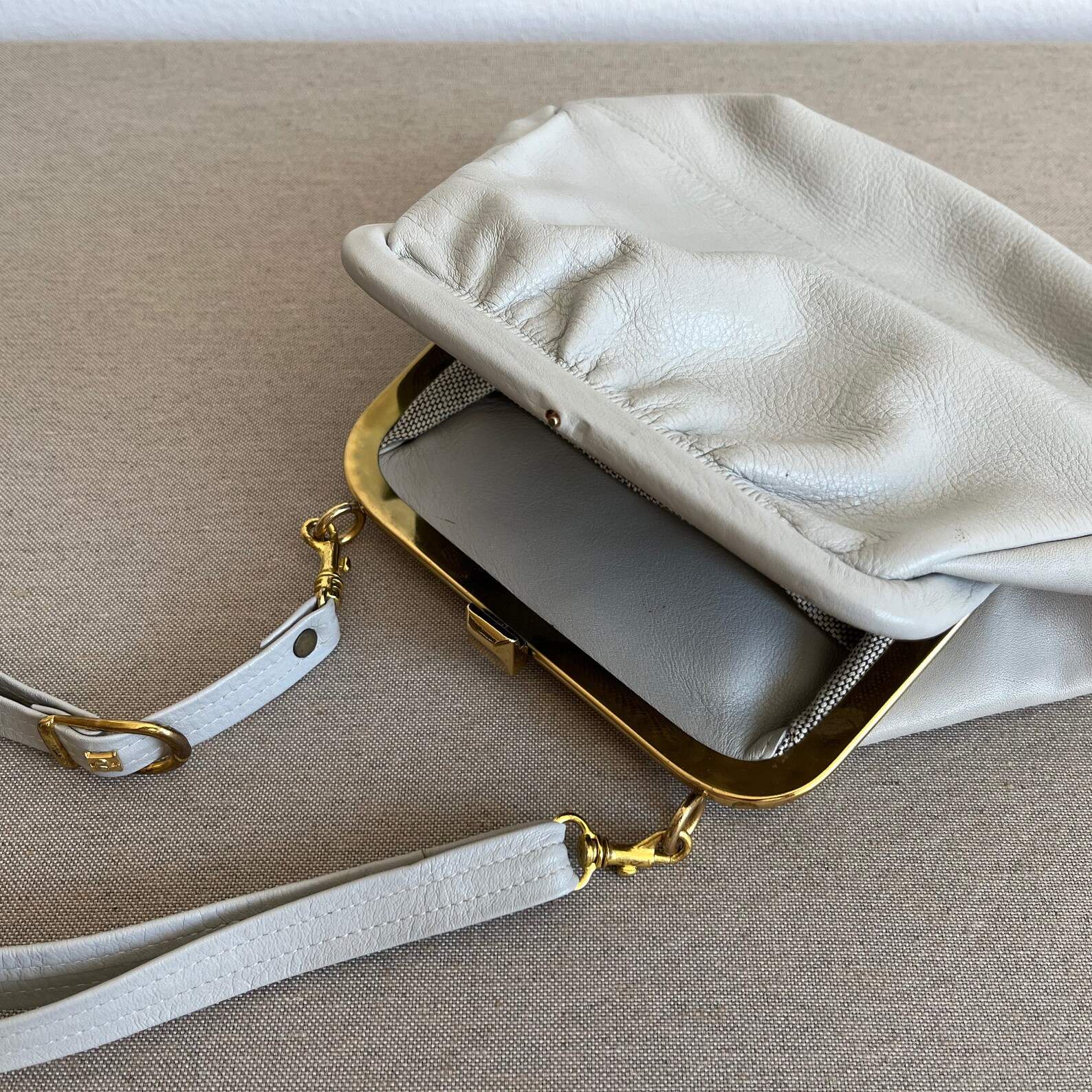A Small Light Gray Leather Purse With a Gold Clasp Shoulder Women’s Bag ...