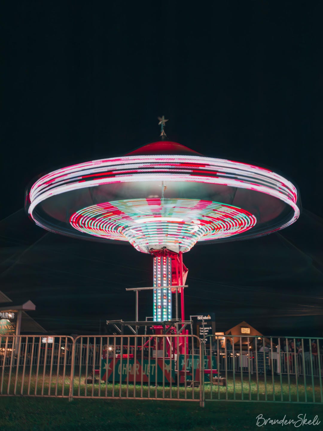 Spinning Carnival Ride at Night - Long Exposure Amusement Park ...