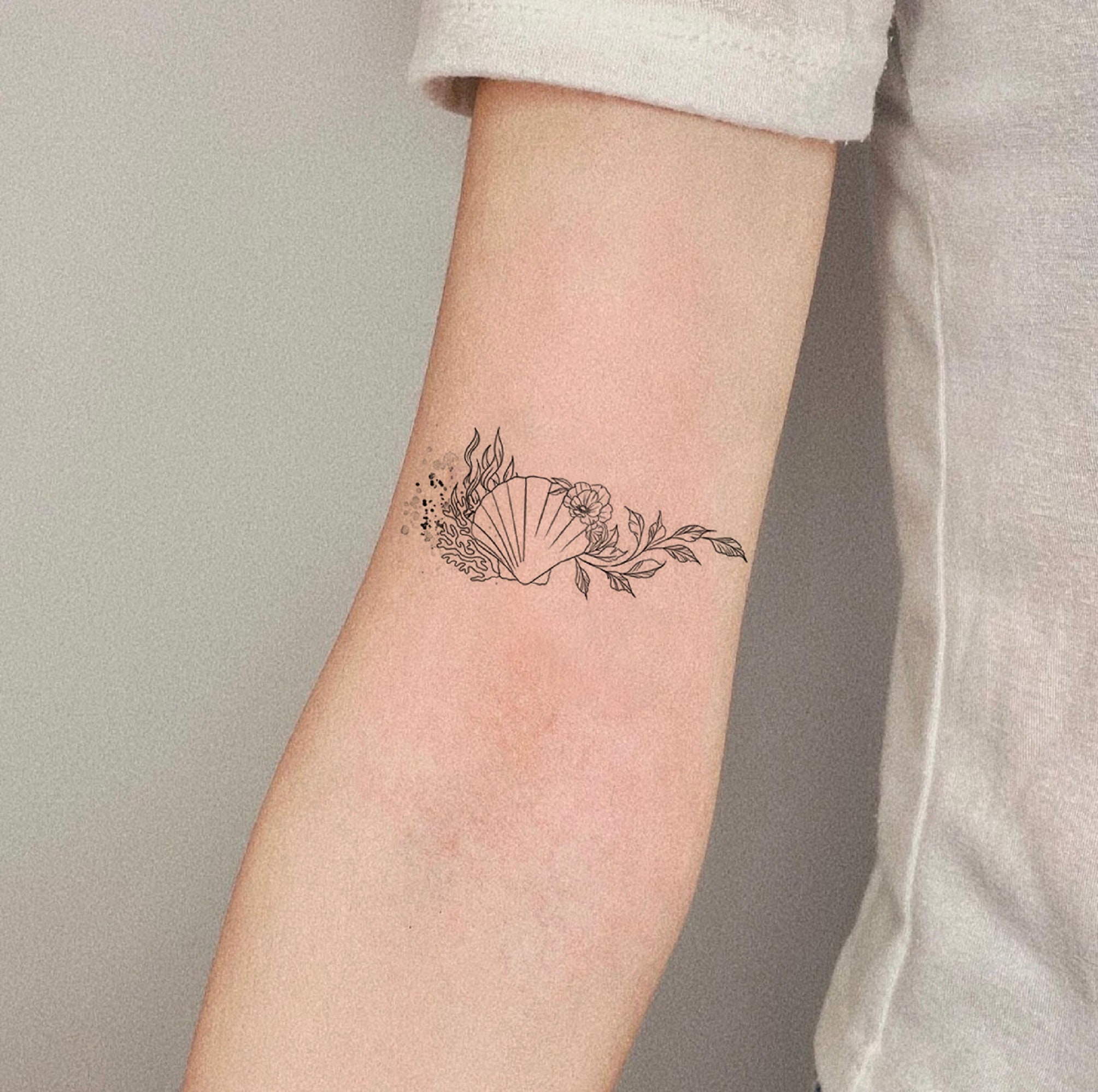 Seashell With Pearl Tattoo