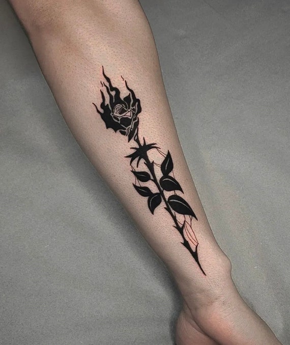Black And Grey Fire Tattoo