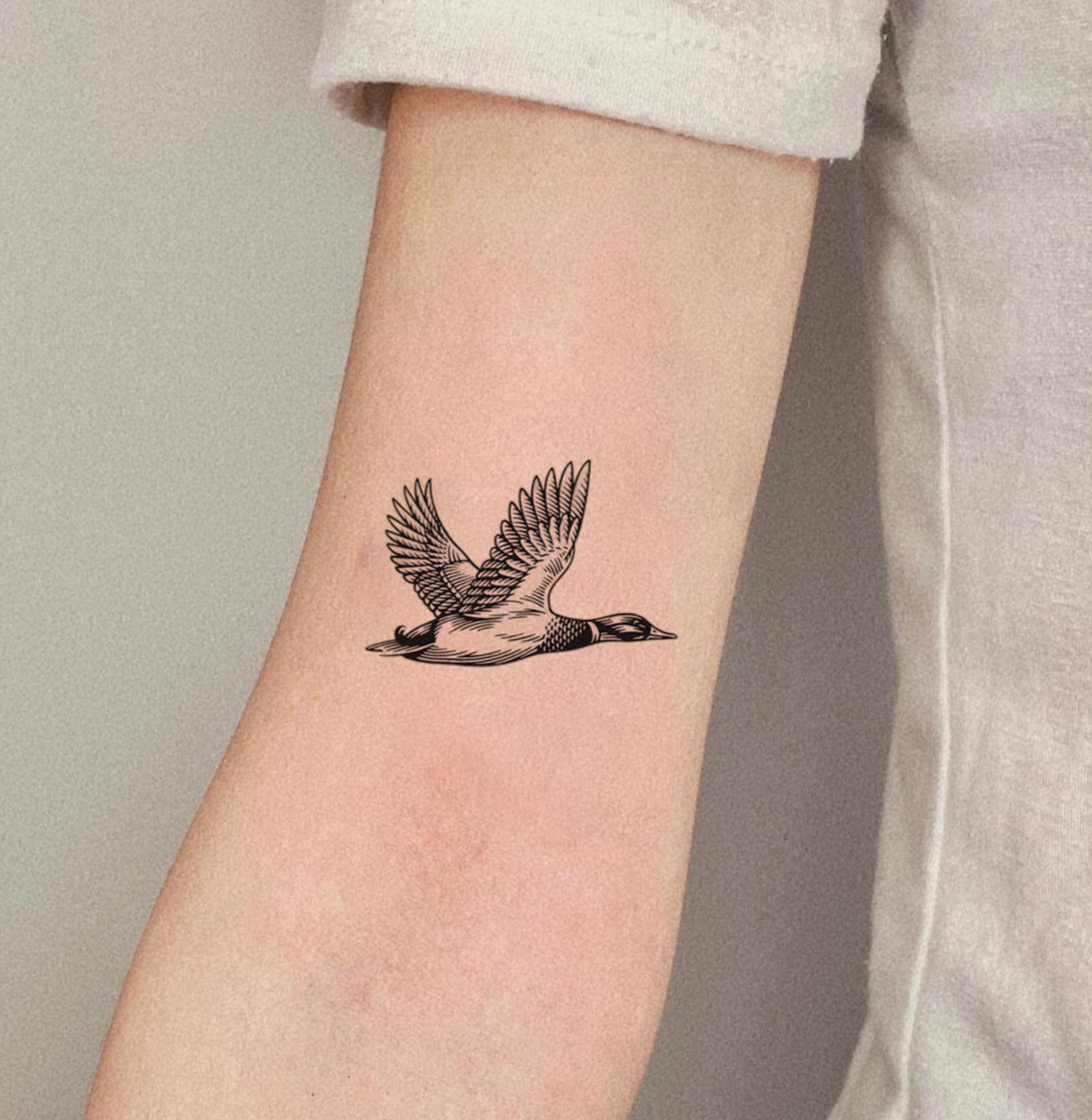 Duck Flying Tattoos Designs