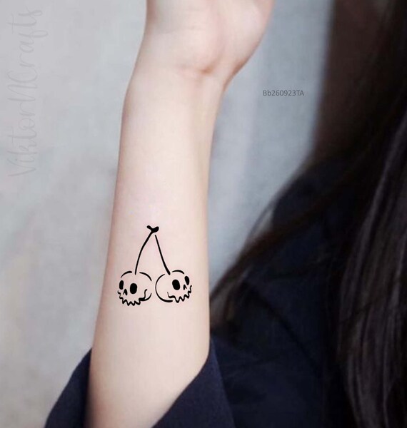 Tiny Skull Tattoo
