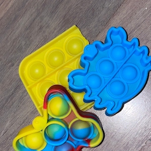 Pop It’s in All Different Colours and Shapes Such as Squares ,stars ...