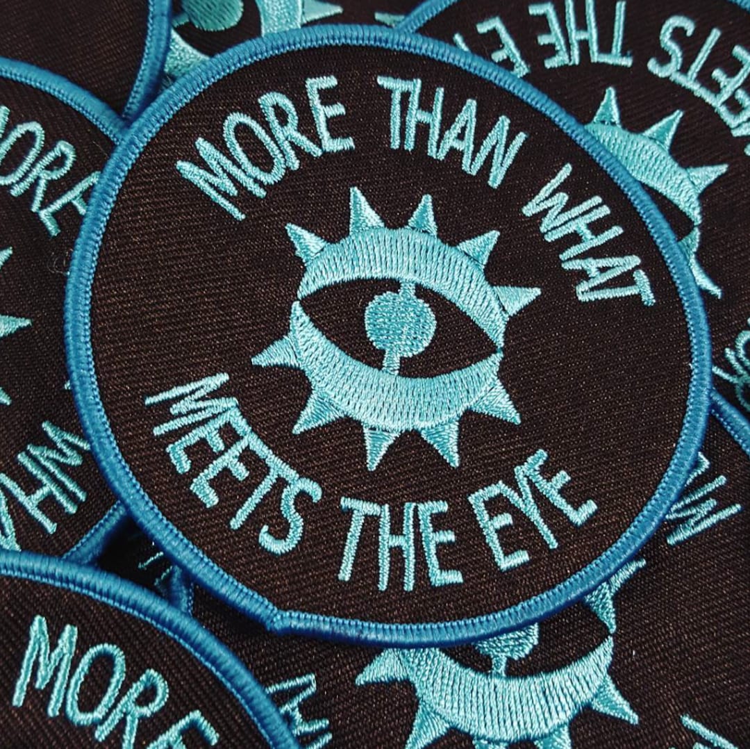 More Than What Meets the Eye Sew-on Patch – Black and Light Blue ...