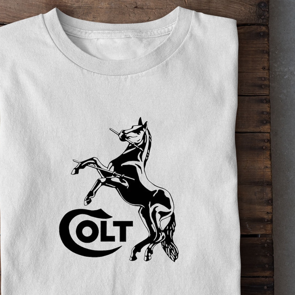 Colt Firearms Gun Logo T-shirt Size S-3XL Designed & Sold By Emma Davidson