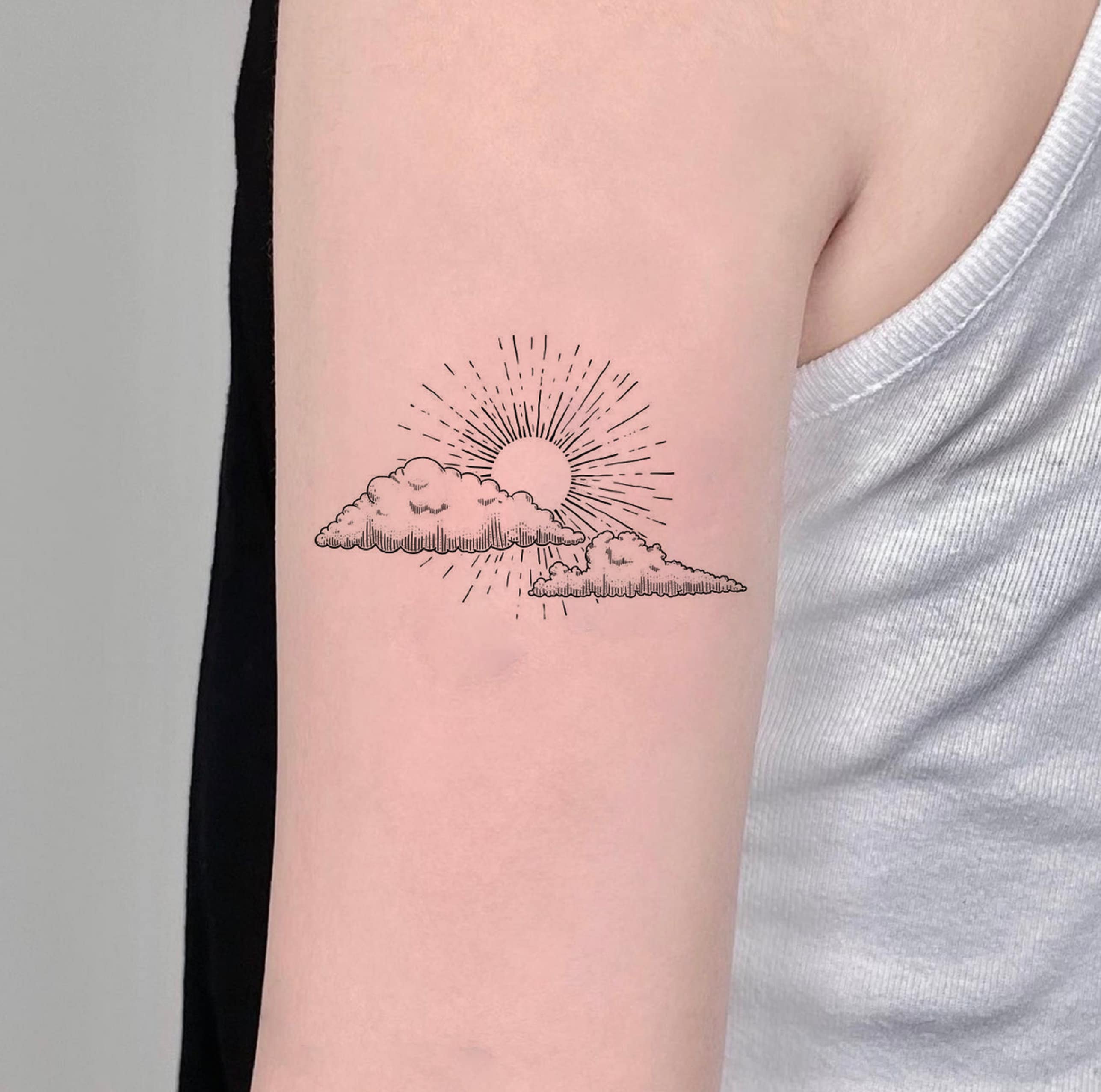 Sun And Clouds Tattoo