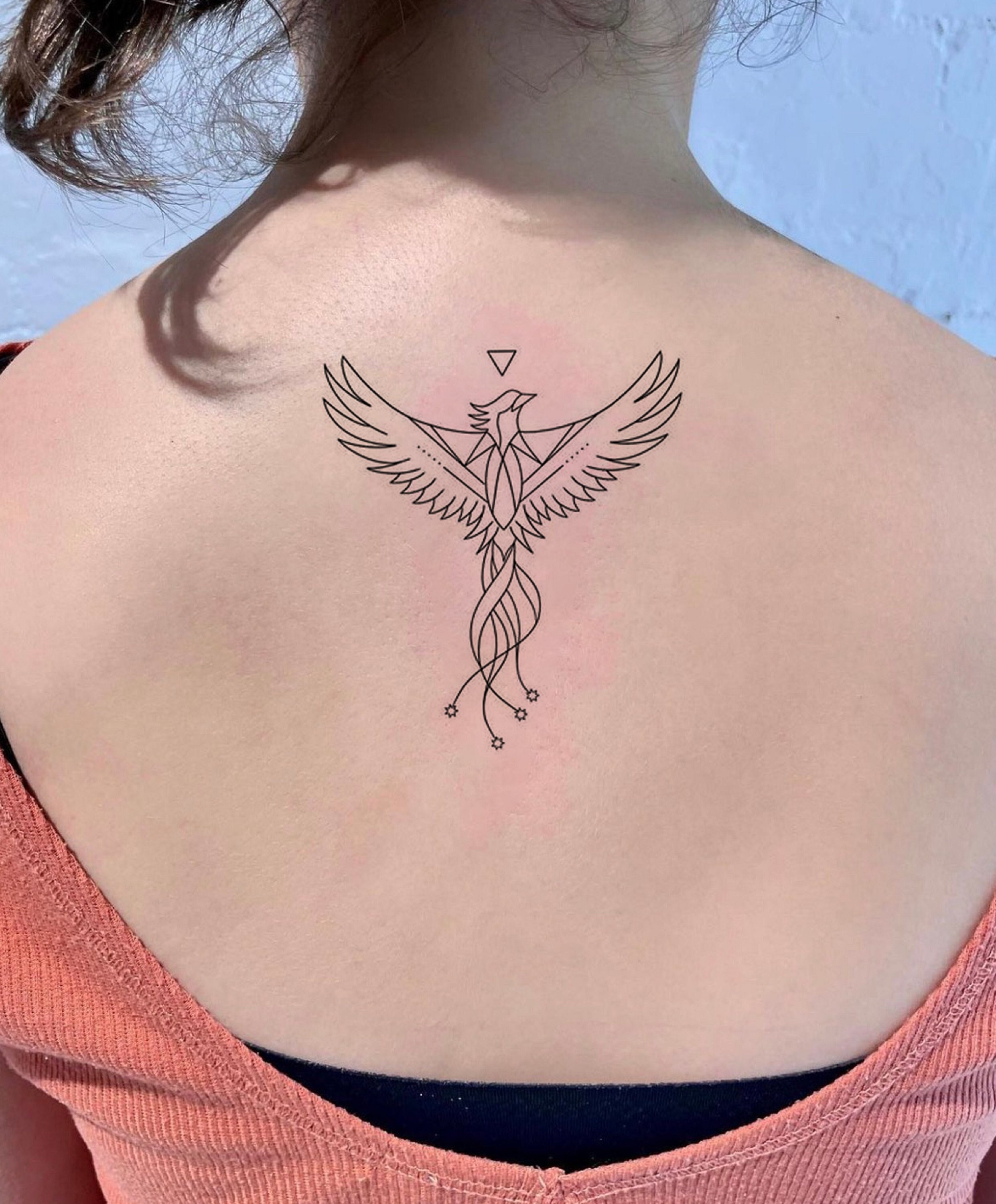 Beautiful Phoenix Rising Tattoo