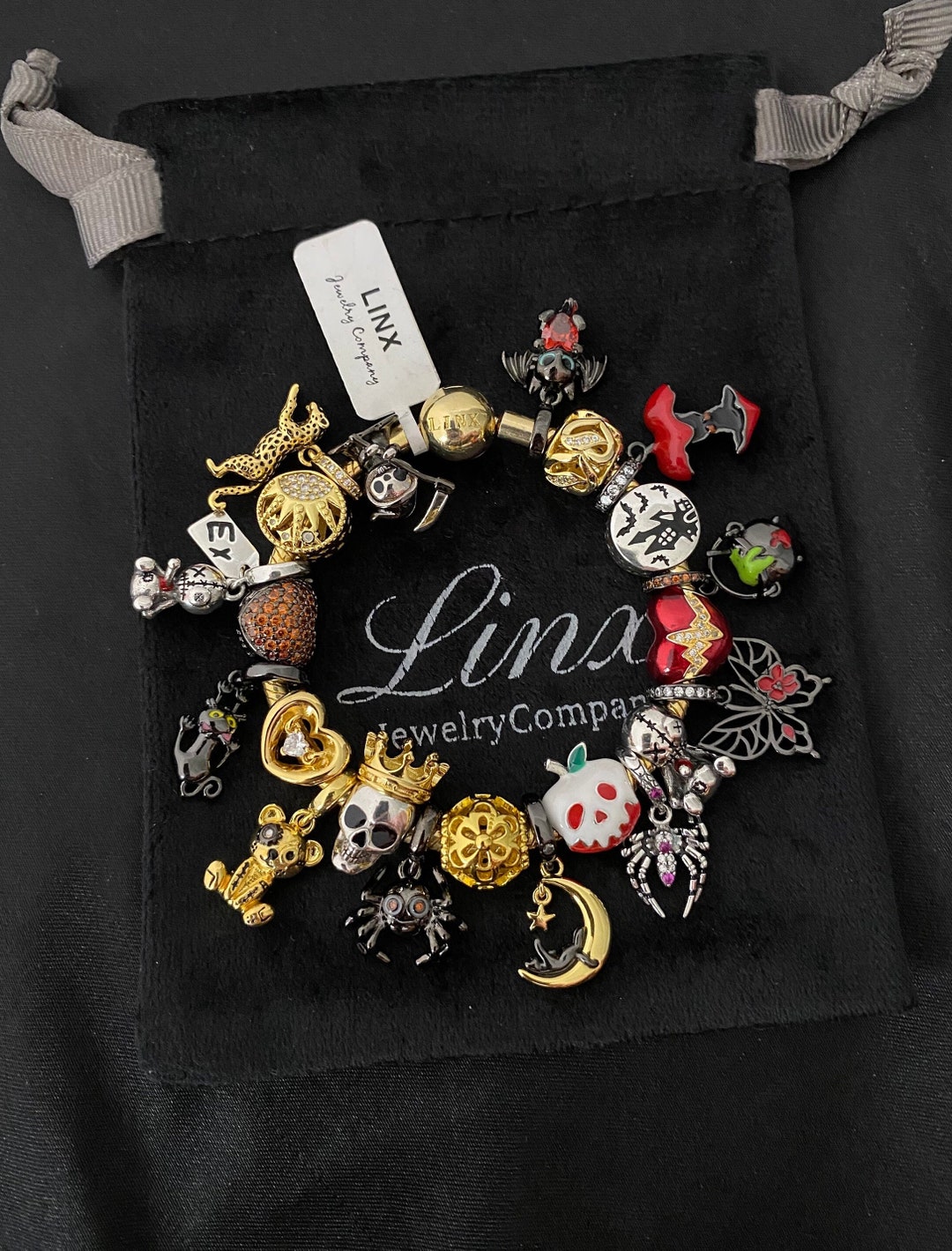 Linx Gold Bracelet With Black Skull and Voodoo Doll Themed Charms - Etsy