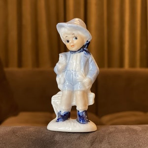 Porcelain Little Boy Figurine the Boy is Happy to Have a Bunny in His ...