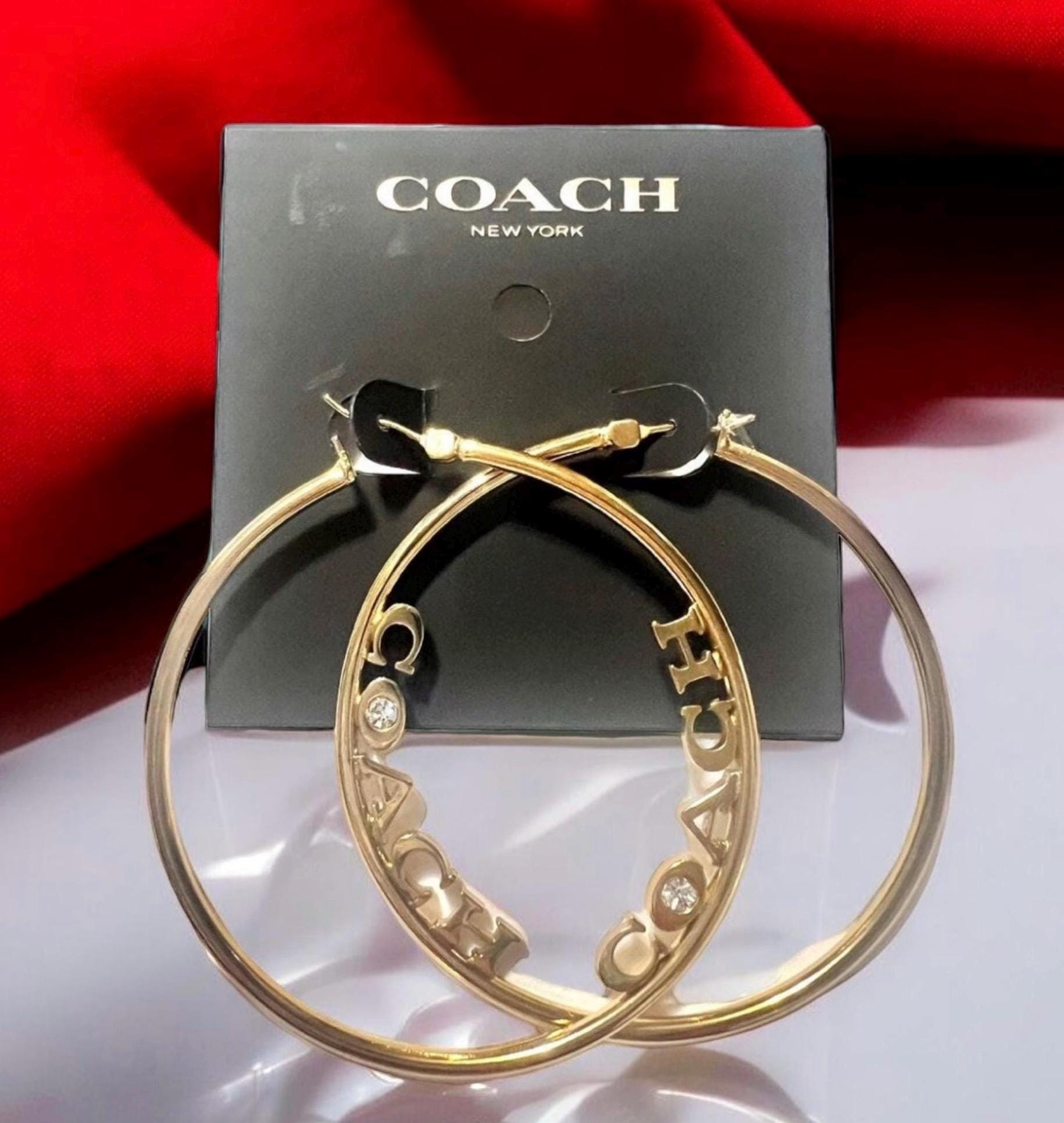 Coach hoop earrings Gold tone earrings Gift Gifts Hoops Gold hoop earrings Jewelry Designer earrings Coach earrings Coach gold hoops