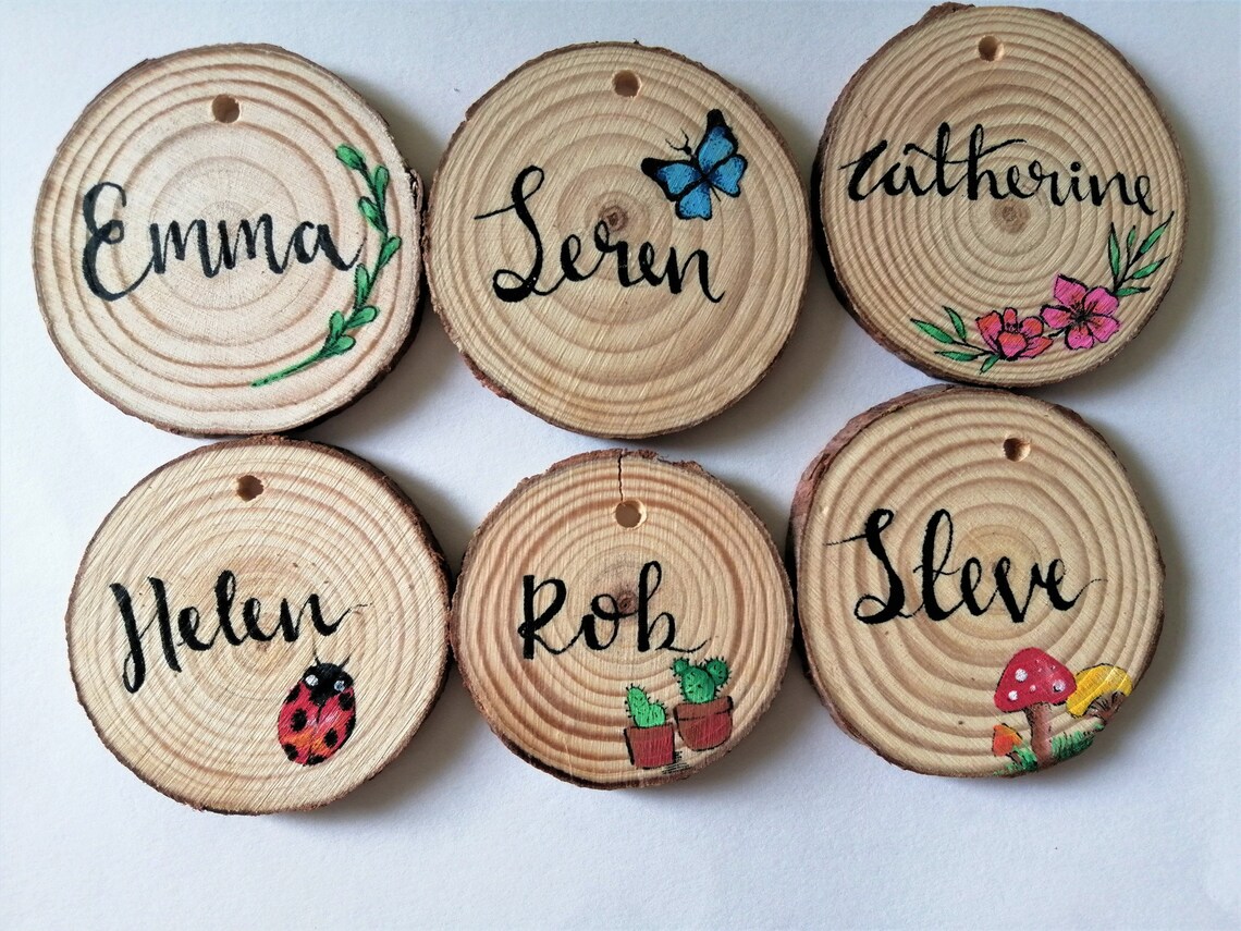 Hand painted personalised wooden name discs wedding place | Etsy