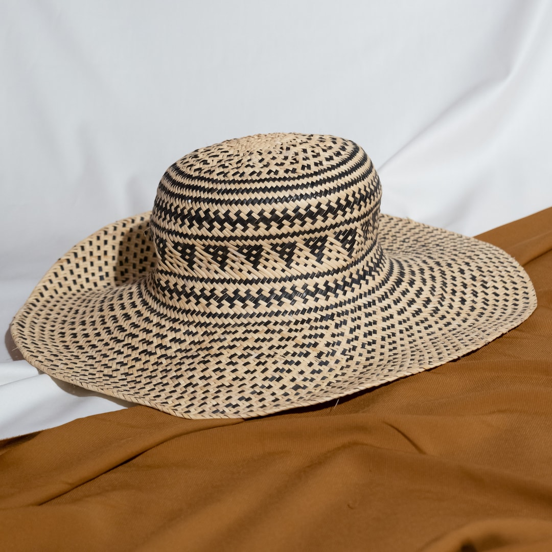 Tropical Elegance: Handcrafted Rattan Beach Hat With Exotic Motifs at ...