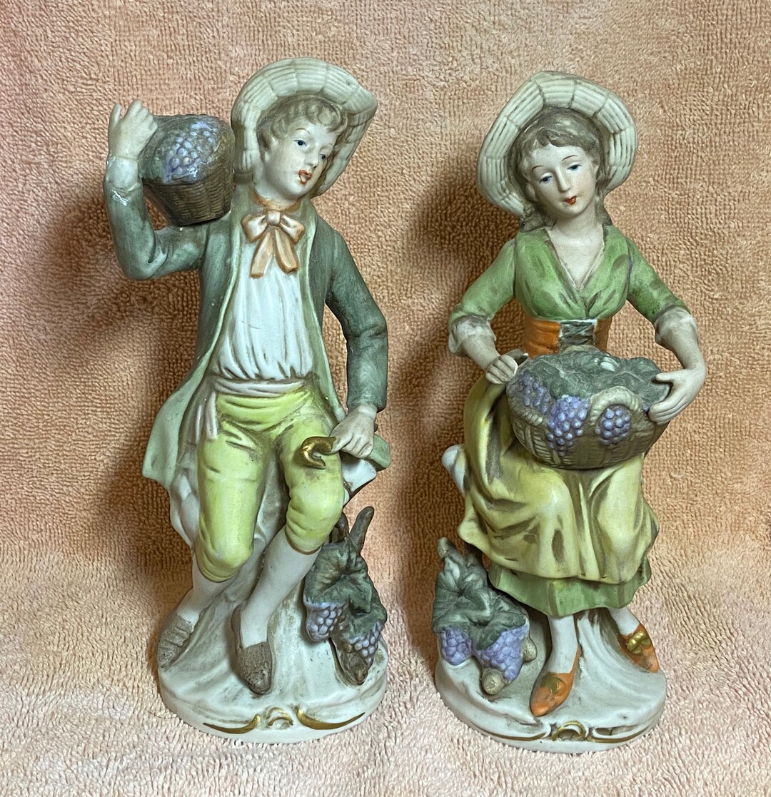 A Pair of HOMCO Figurines of a Young Boy and a Young Girl Seated With ...