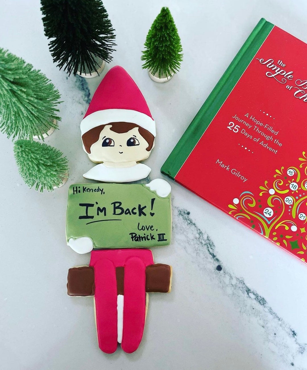 An Elf Themed Cookie With Custom im Back Sign - Etsy