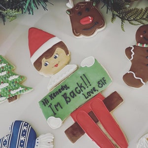 An Elf Themed Cookie With Custom im Back Sign - Etsy