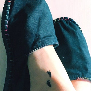 tiny footprint tattoos