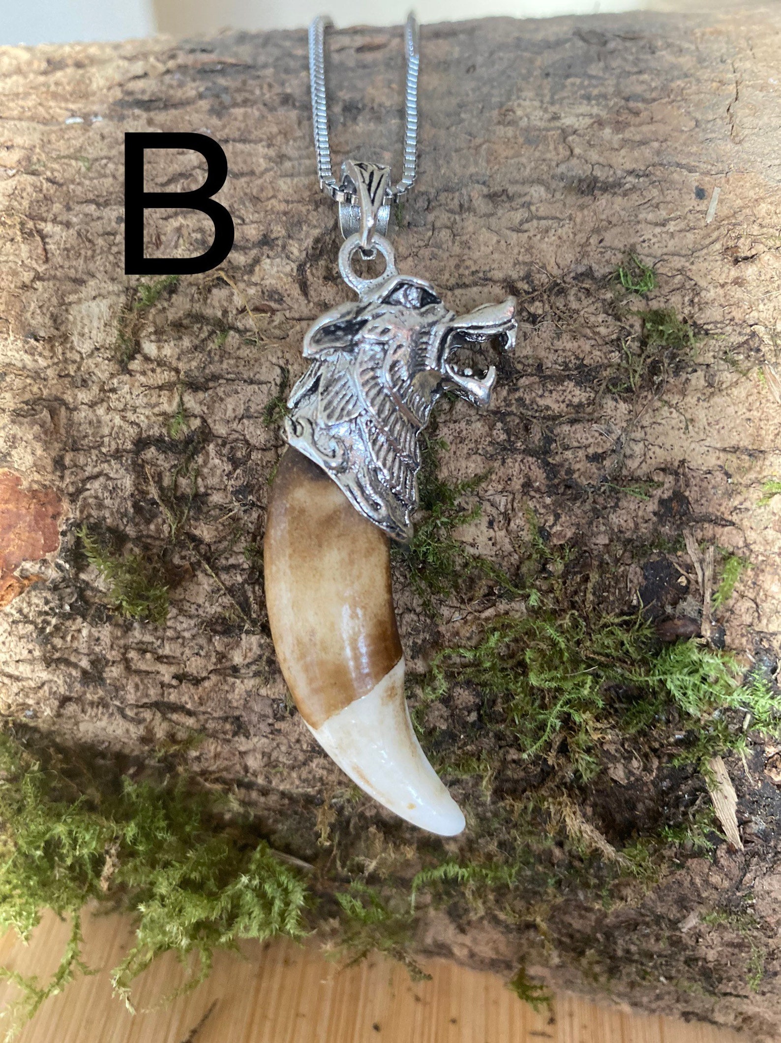 A Real Tibetan Wolf Tooth Mounted in a Silver Plated Wolf Figure ...