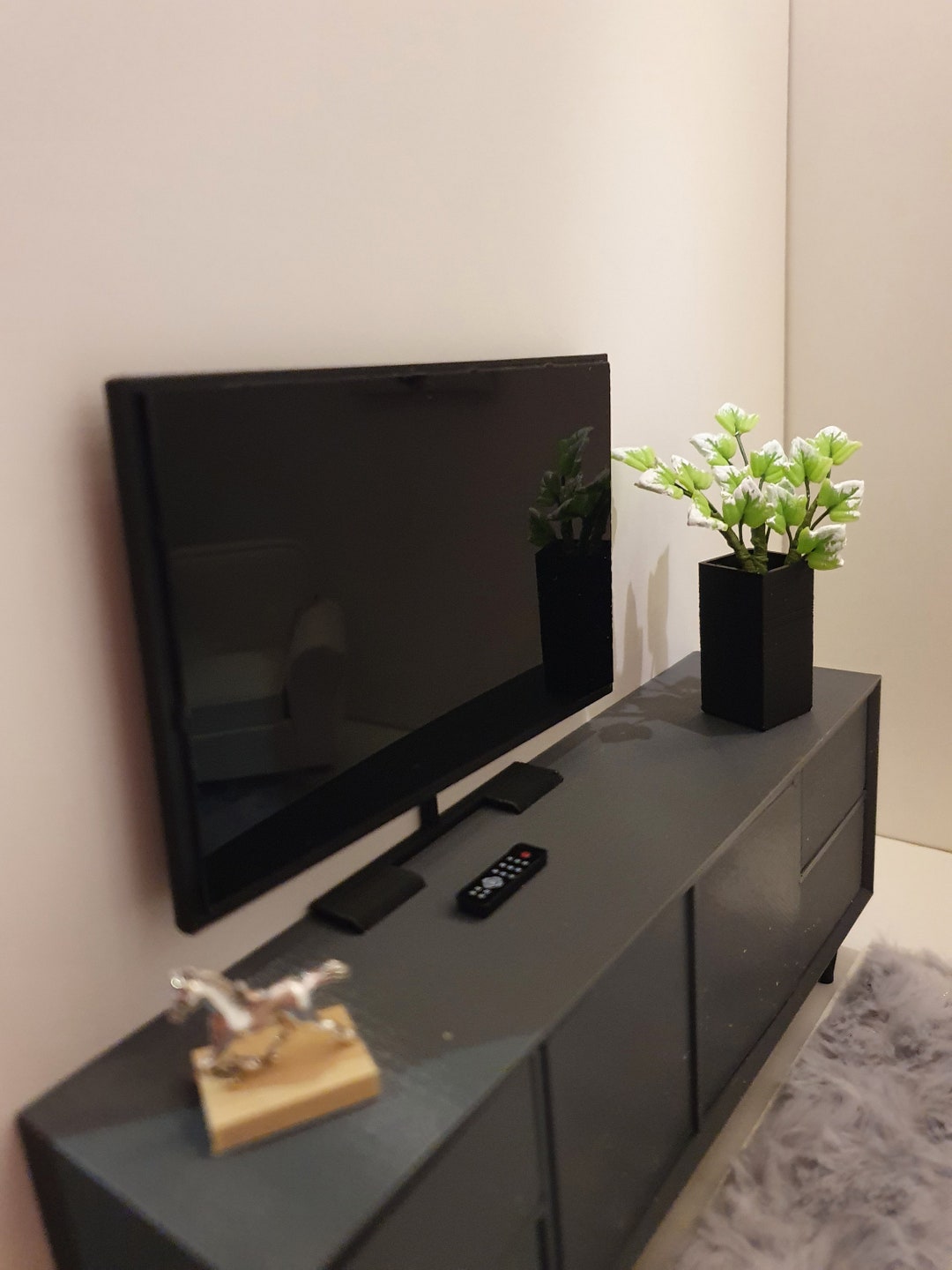 Modern Flatscreen Television on a Modern Stand With Remote Control ...