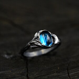 Mystical Black Witch's Wedding Ring Featuring an Oval Topaz Stone and ...