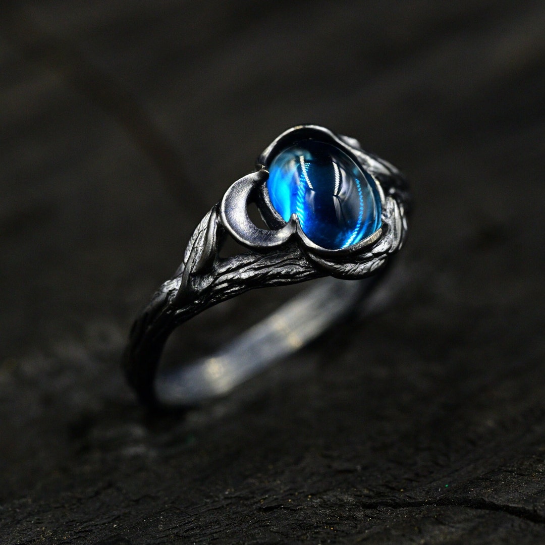 Mystical Black Witch's Wedding Ring Featuring an Oval Topaz Stone and ...