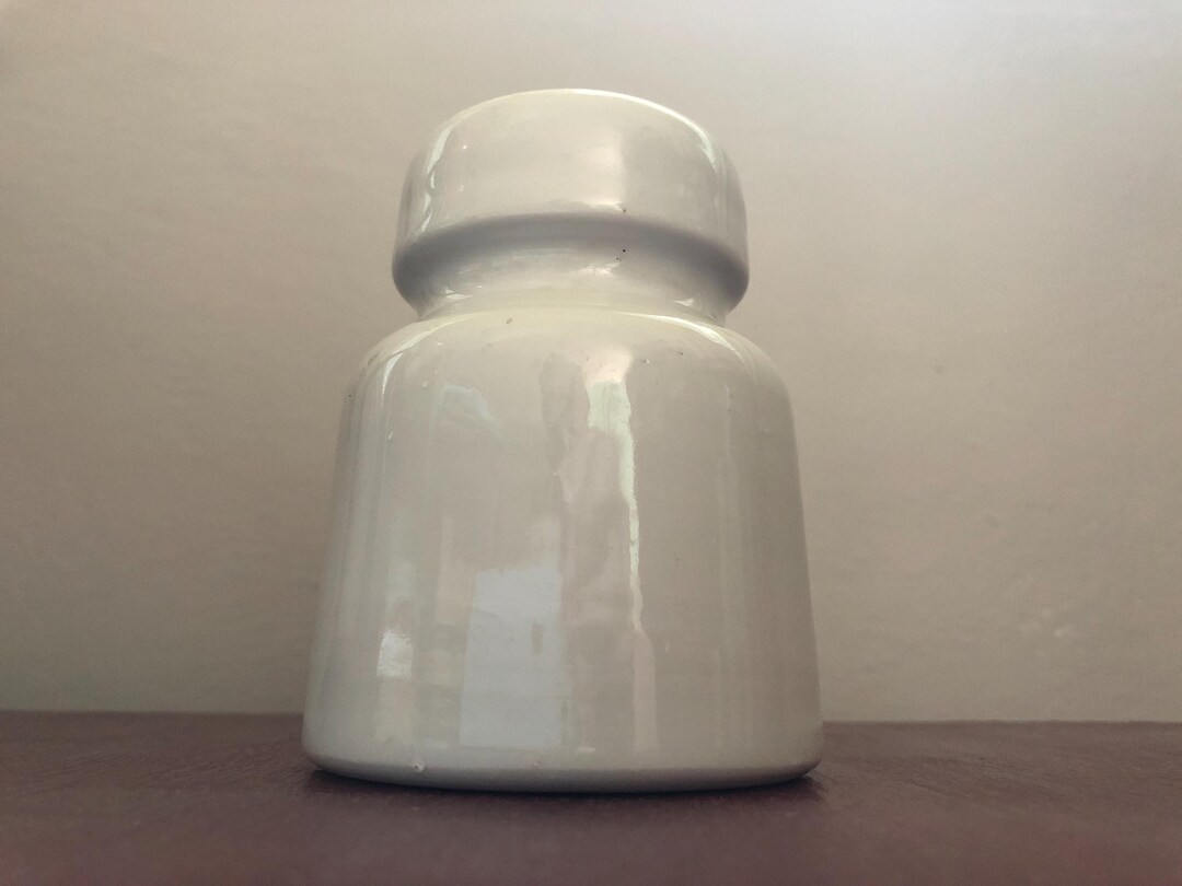 Antique White Ceramic Electrical Insulator. Used to Isolate the Passage ...
