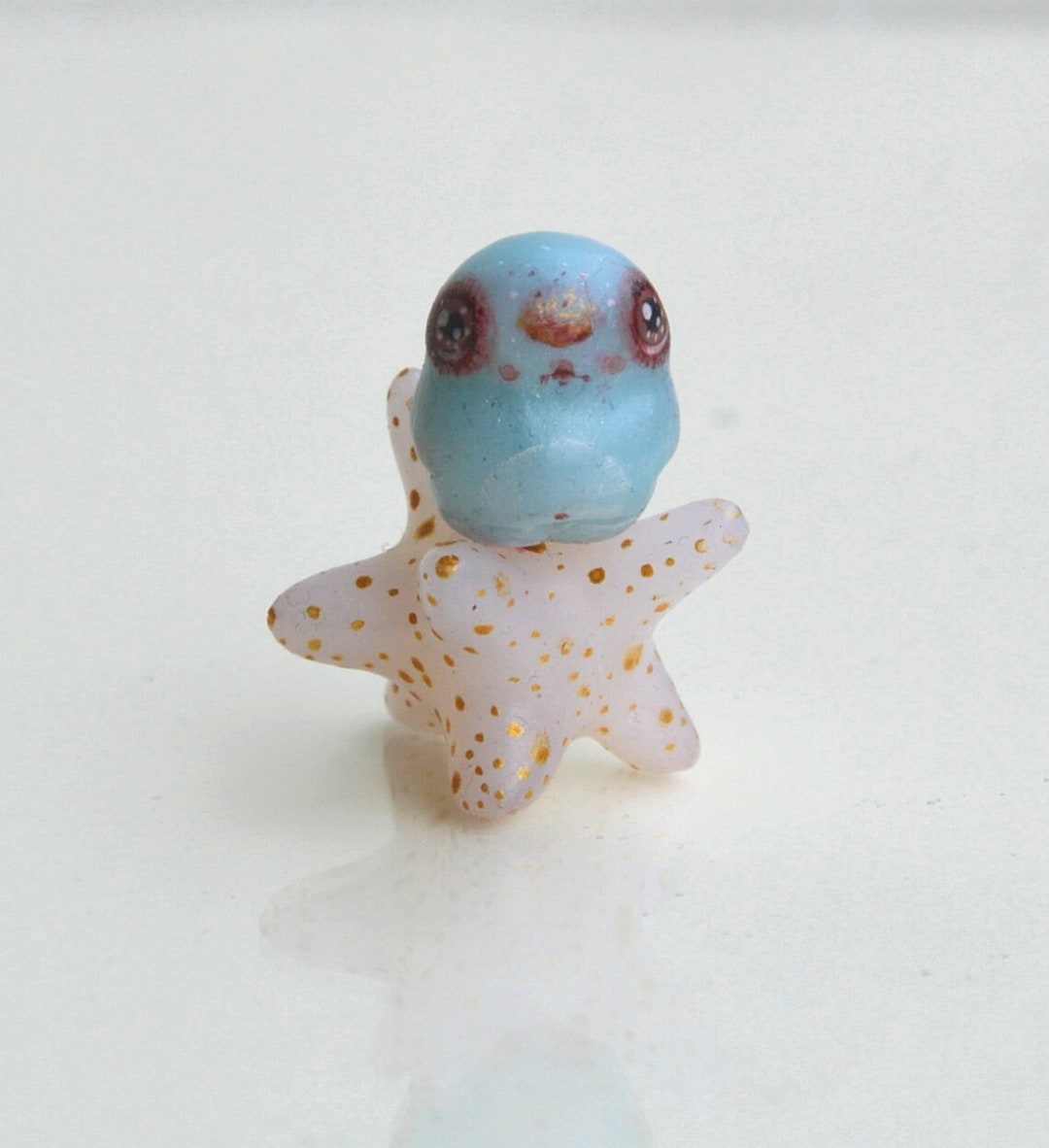 A Lonely Blue Starman on a Small Star Somewhere in the Sky. Miniature ...