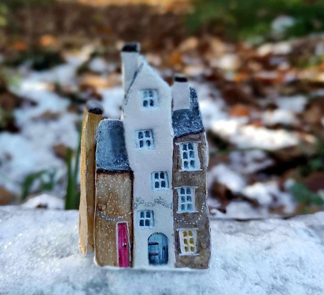 Tall Terrace of Miniature Ceramic Townhouses With Snowy Roofs and a Red ...
