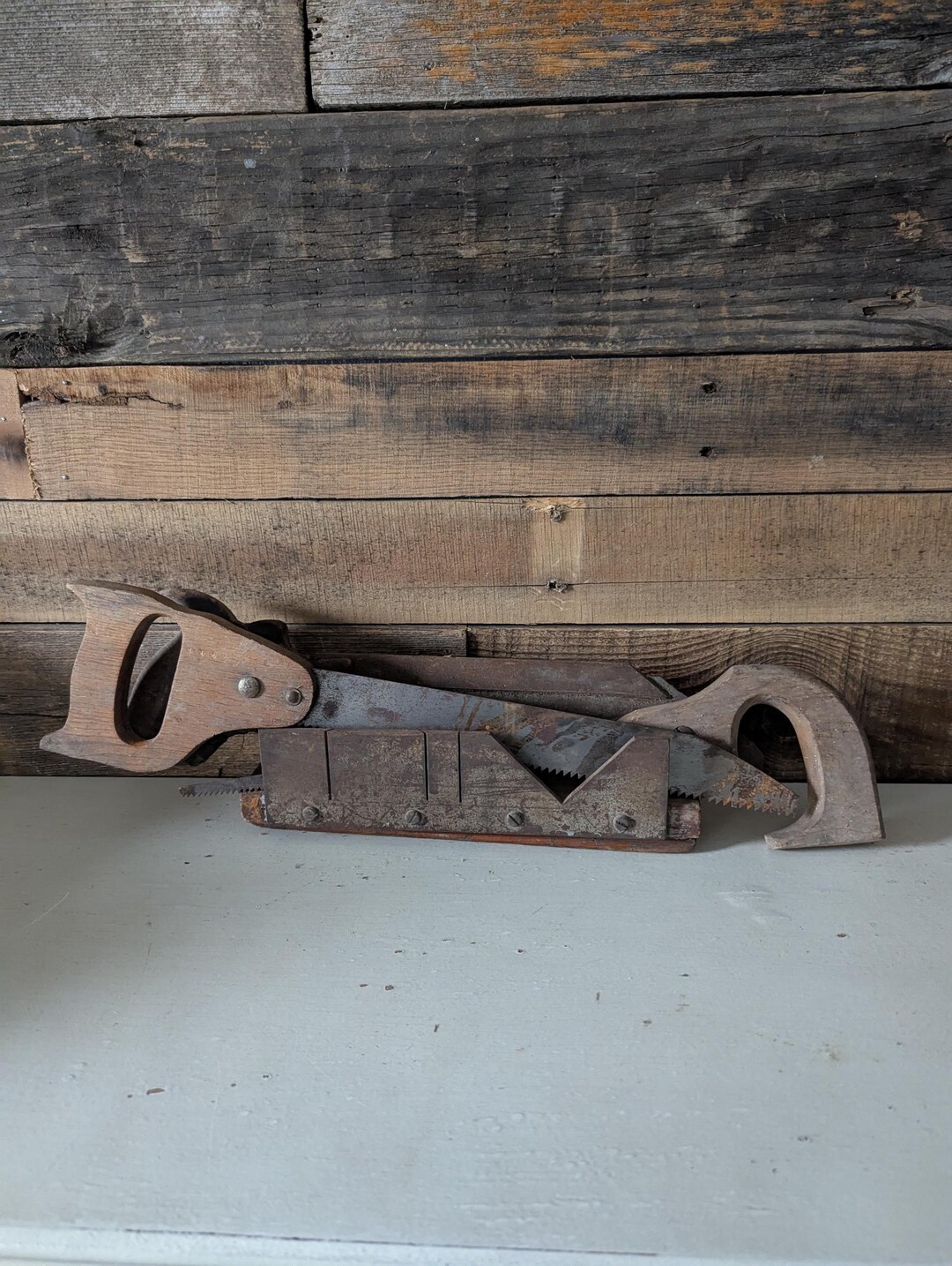 Vintage Saws and Mitre Box Three Rusty Saws One Wood and Metal Mitre ...