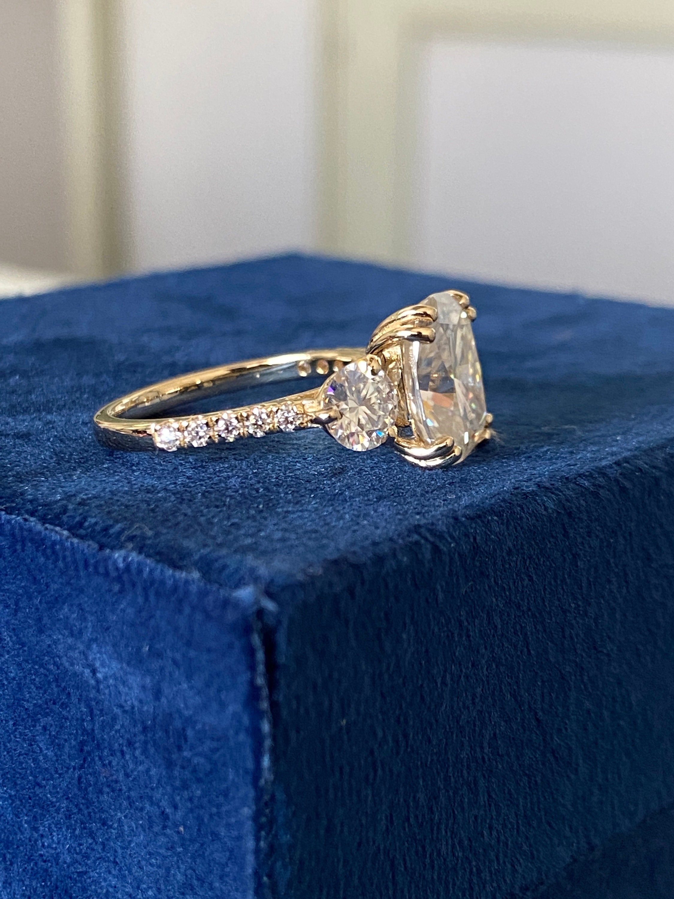 3.0 Carat Elongated Cushion Cut Moissanite Trilogy Round Cut Side ...