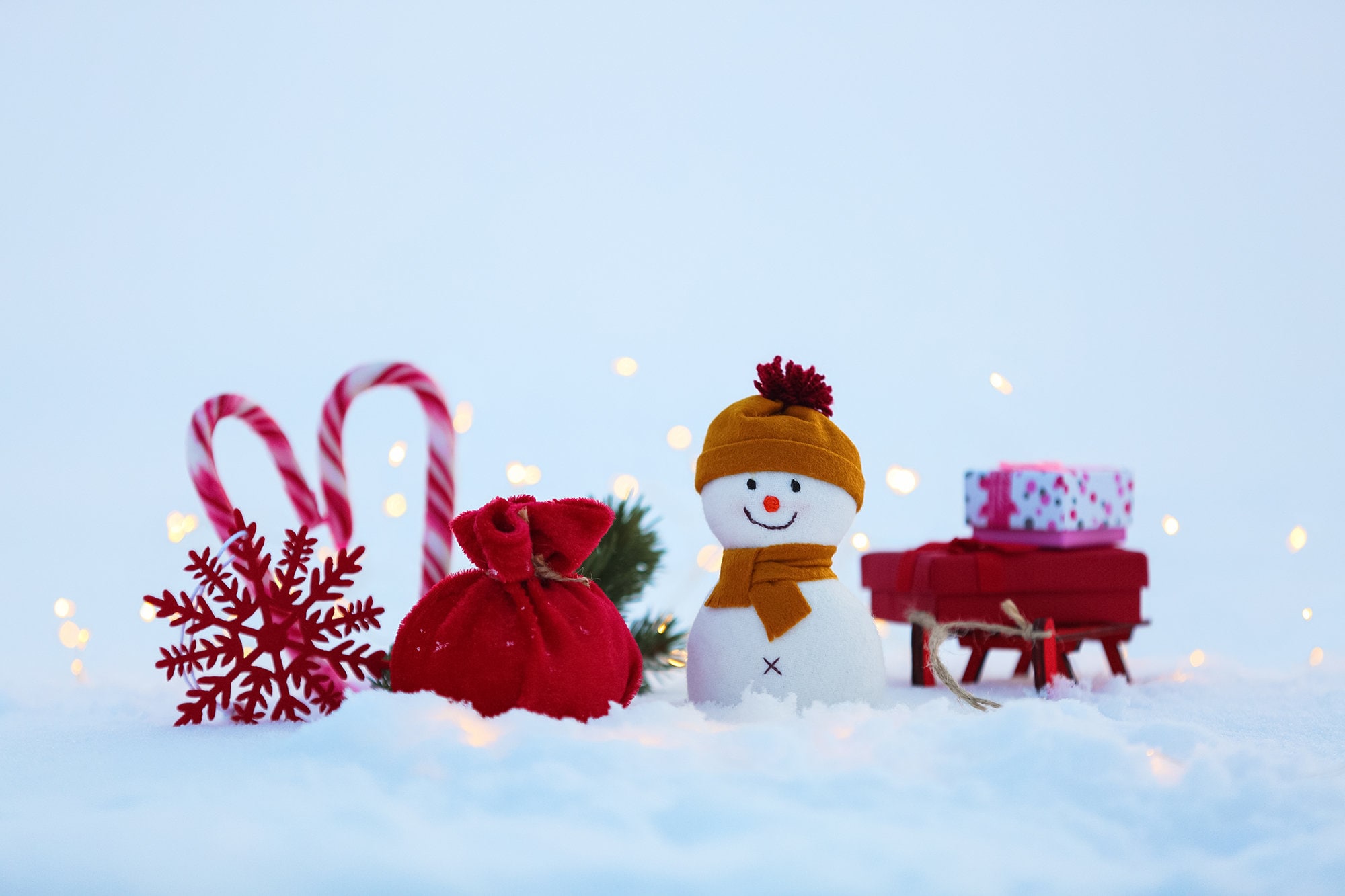 Funny Snowman With Sledges and Colorful Boxes Garlands Enlighten the ...