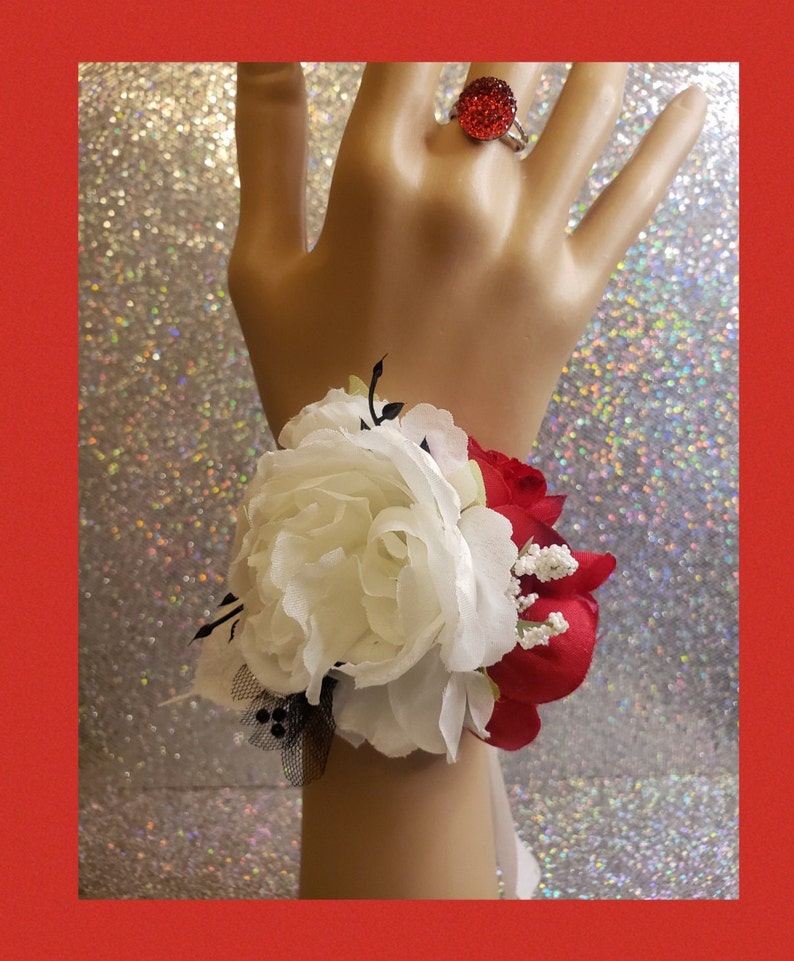 This is a Corsage With Red and White Artificial Flowers Also Black ...