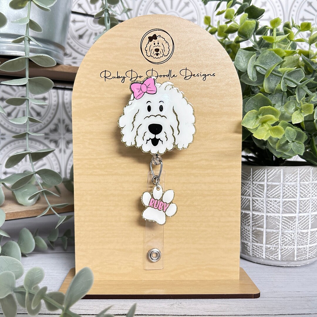 Cream/white Rubydo Shaped Doodle Girl With Bow Badge Reel ...