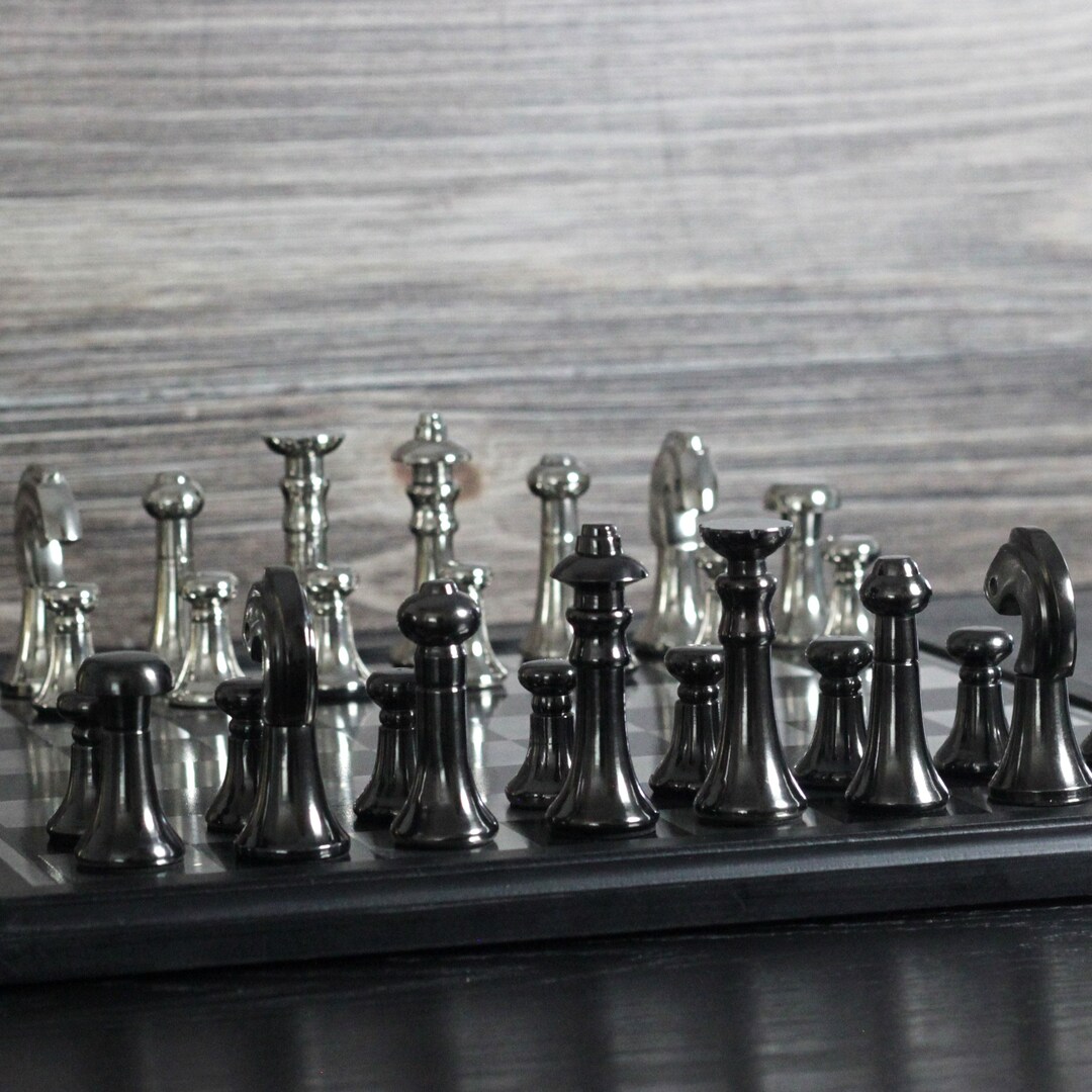 Sleek Metallic Chess Set: Black and Silver Pieces, Unique Shape ...