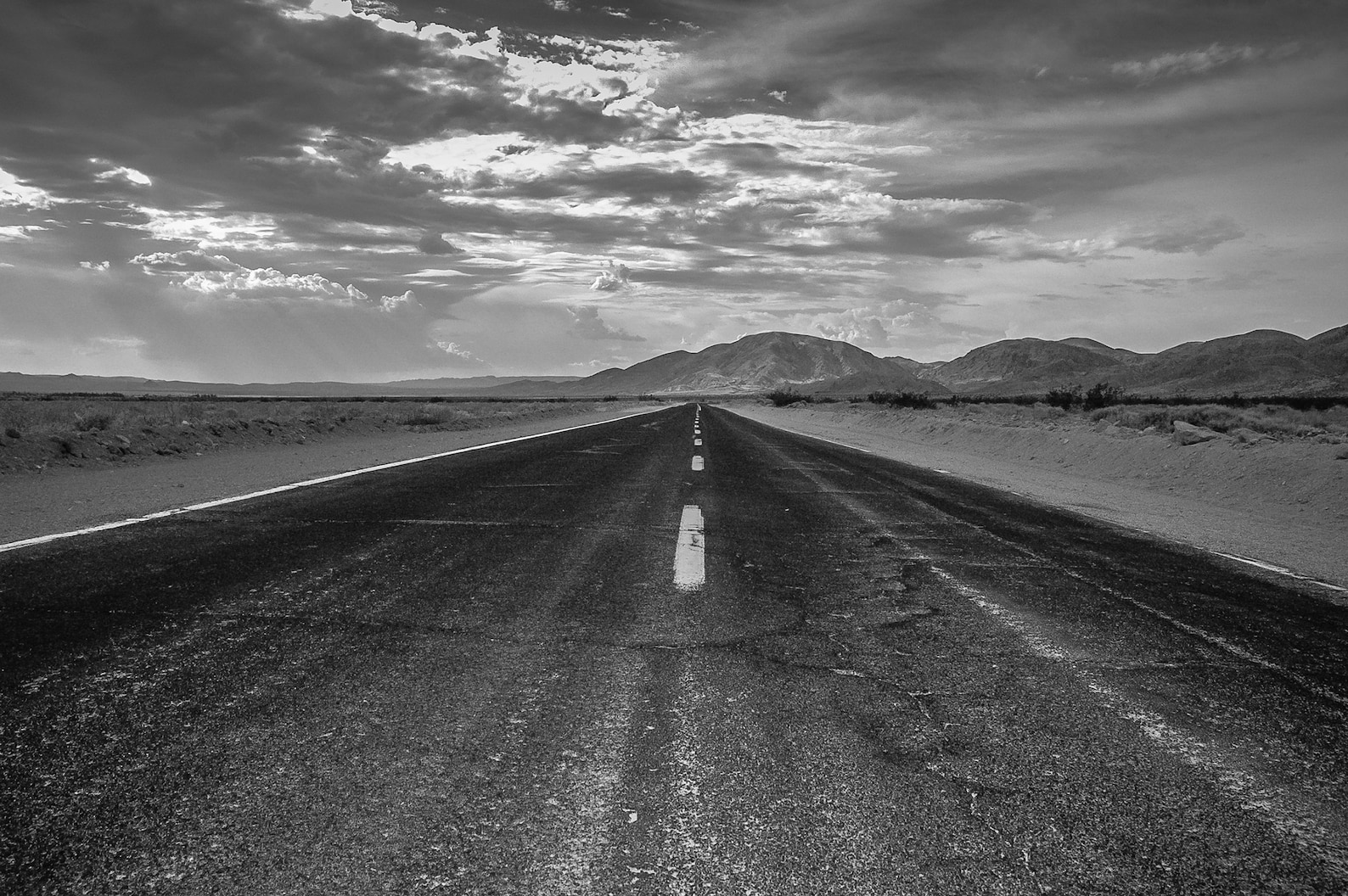 Lonely Empty Broken Road Through the Rural Desolate Nevada Desert ...