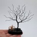 Black Wire Tree Sculpture With Copper Wire Pumpkin on Natural Stone ...