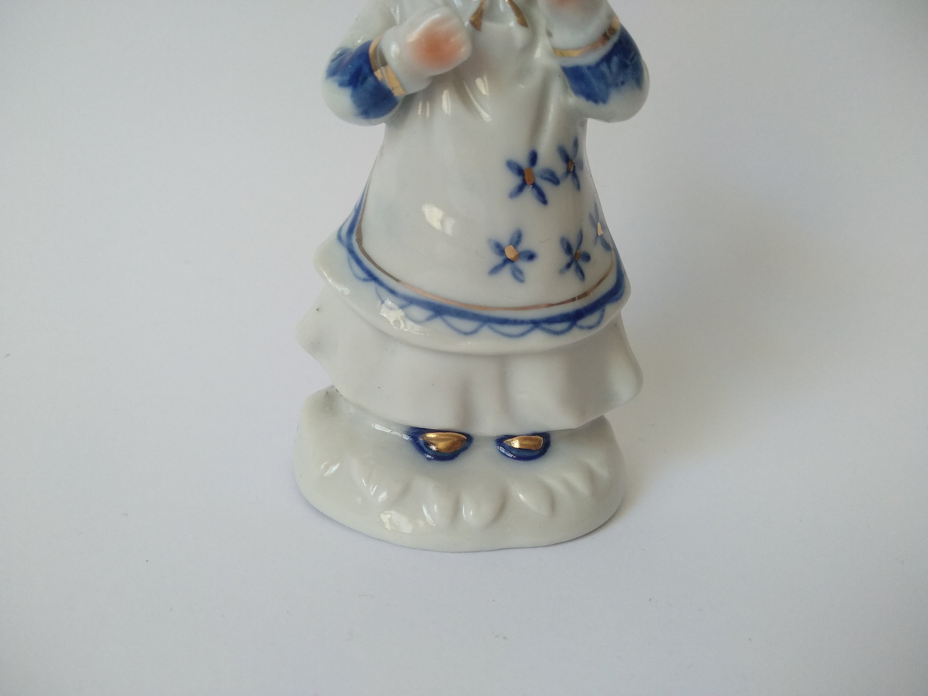 A Porcelain Figurine in the Shape of a Cute Little Girl. Made From Hard ...