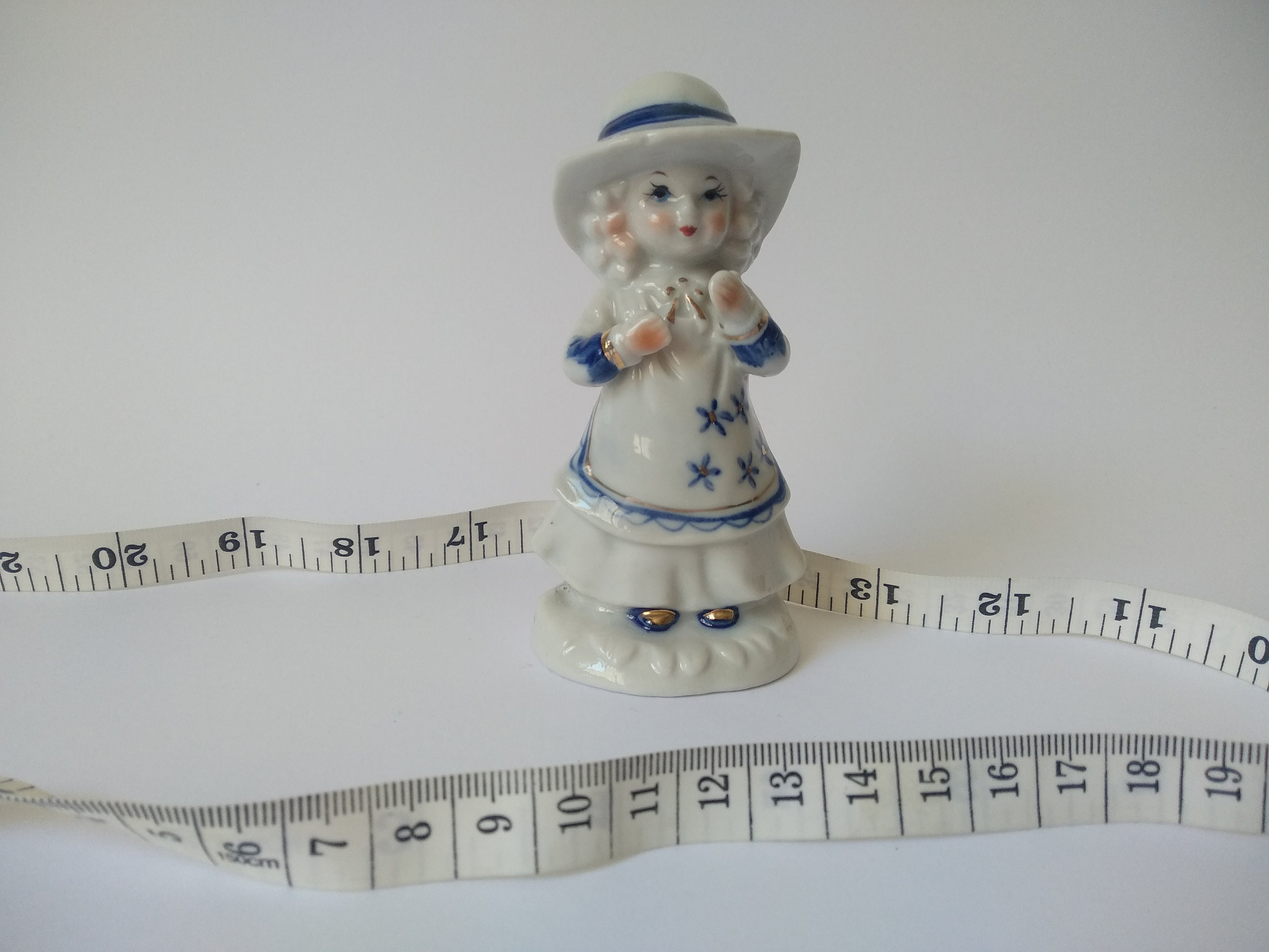 A Porcelain Figurine in the Shape of a Cute Little Girl. Made From Hard ...